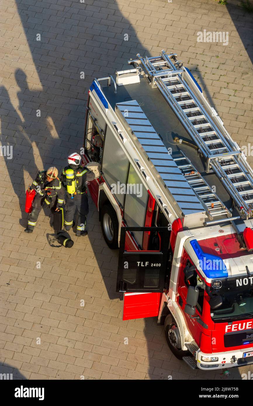 Wien, Vienna: fire department trucks, firemen on the way to a fire in ...