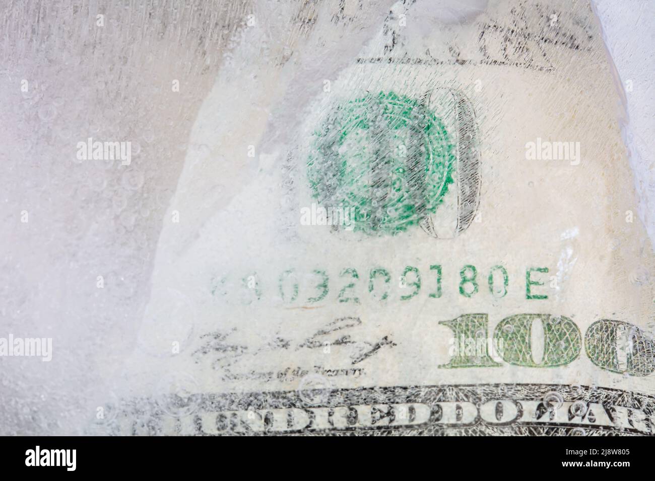 100 US dollar frozen under a layer of ice for design purpose Stock ...