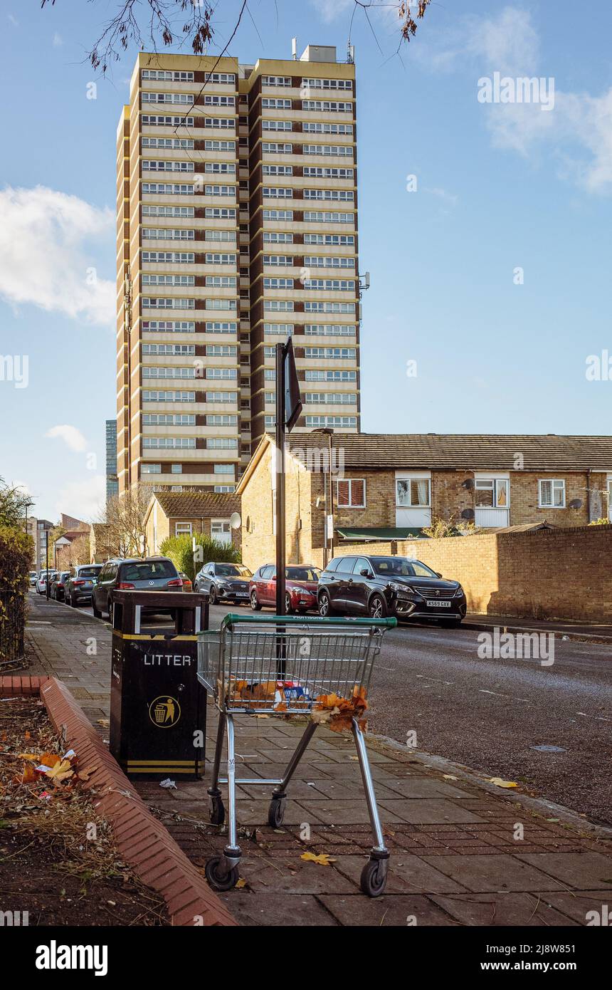 Shopping trolley in front of Holden Point tower block in Stratford ...