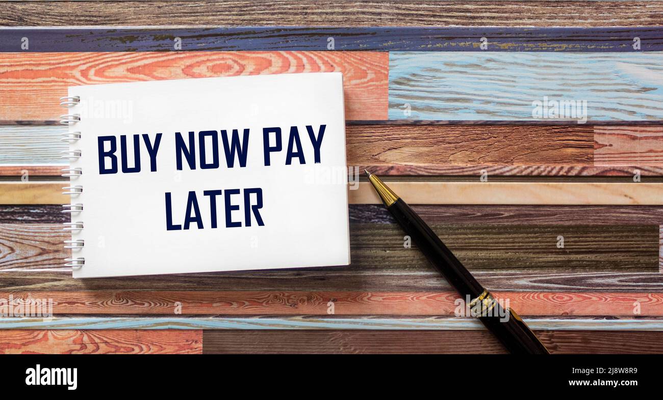 Buy now pay later text concept write on notebook Stock Photo - Alamy