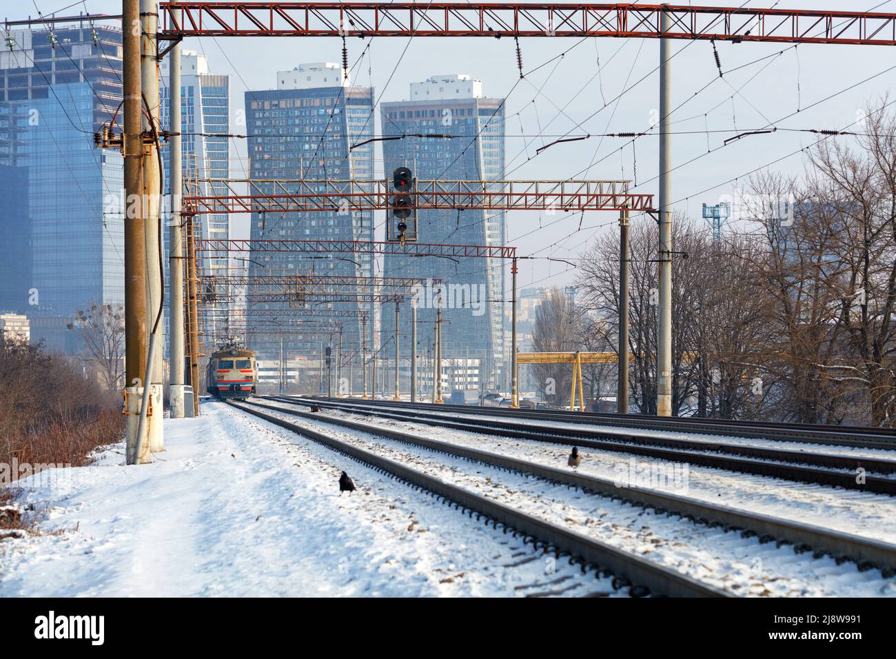 Urban winter landscape with a view of a multiline railway line with a ...
