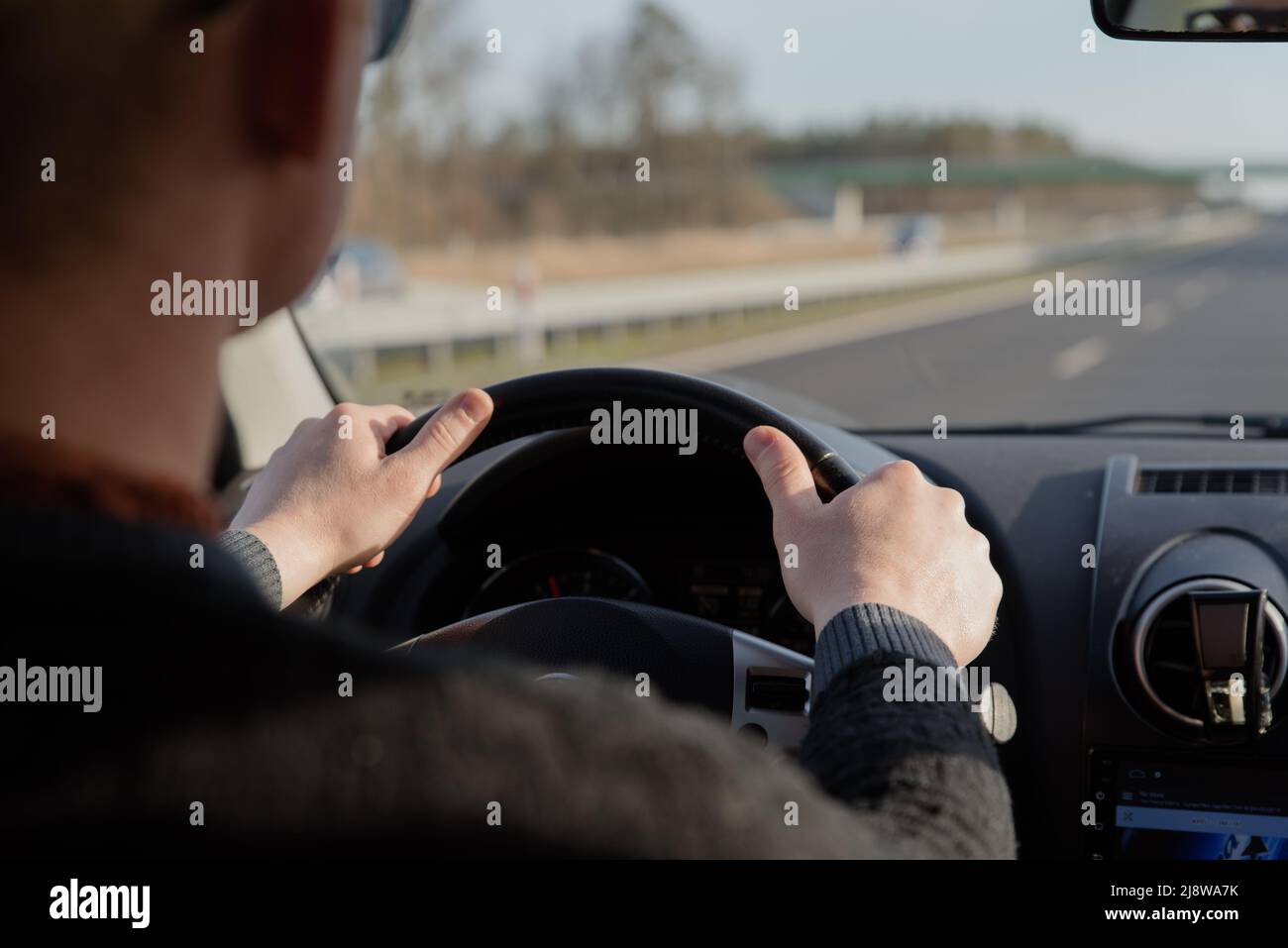 guy driving a car .Young man driving a car, interior shot . driving ...