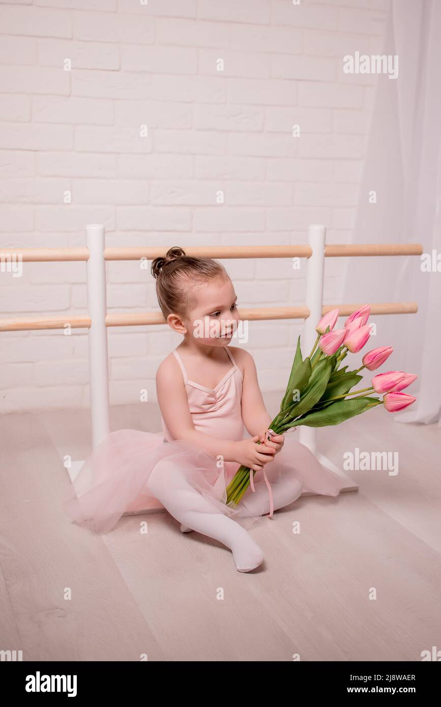 Ballet teacher and little ballerina have practice in dance class ...