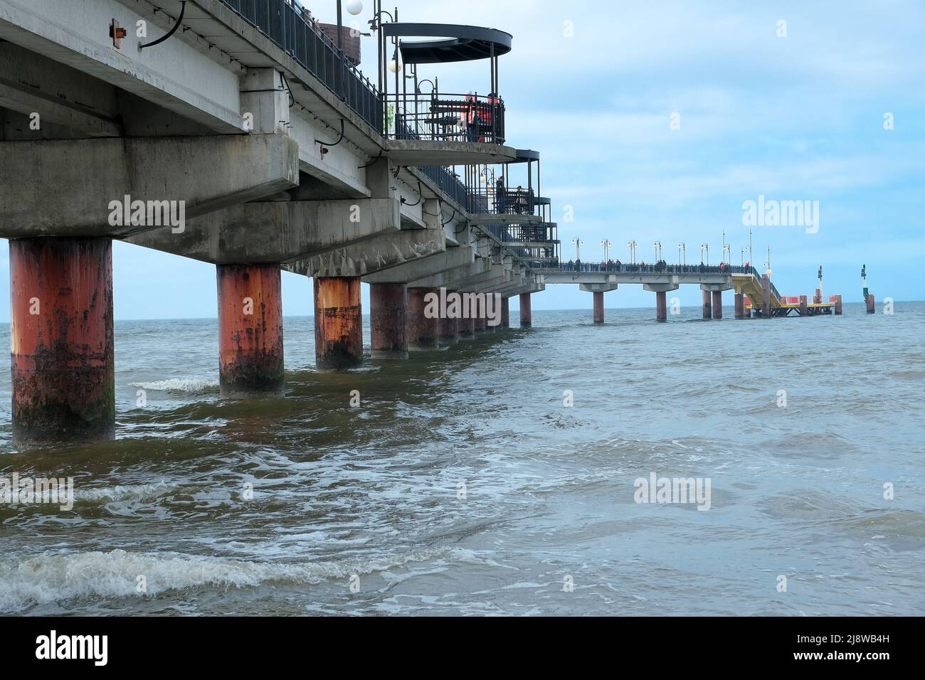 bridge extending into the distance of the sea. beautiful view of the ...