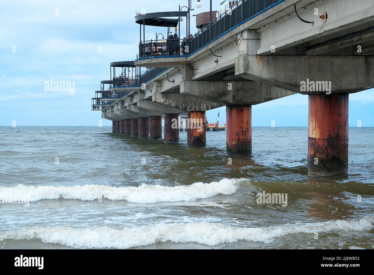 bridge extending into the distance of the sea. beautiful view of the ...