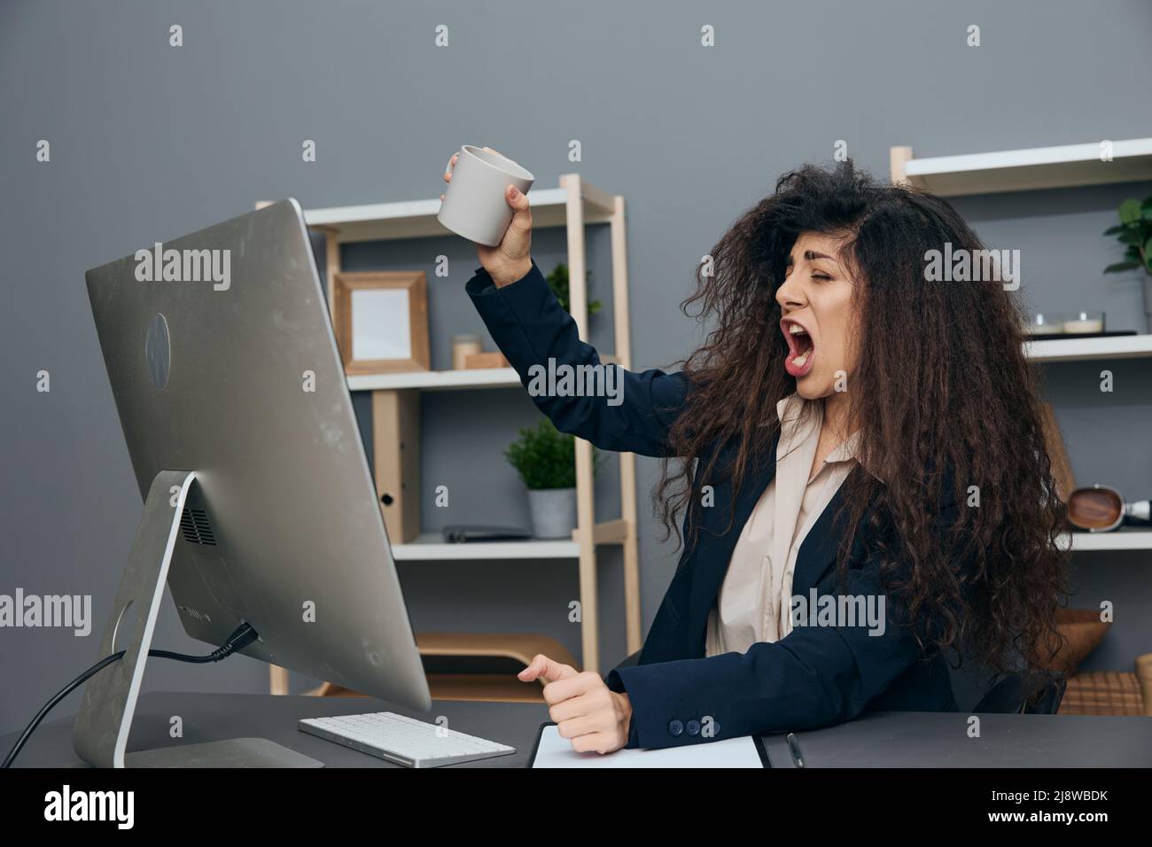 Screaming evil irritated tanned adorable curly Latin businesswoman in ...