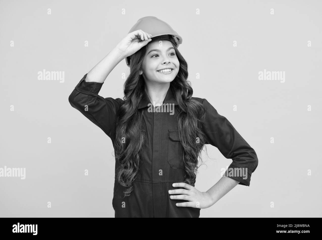 cheerful child girl in protective hard hat, labourer Stock Photo - Alamy