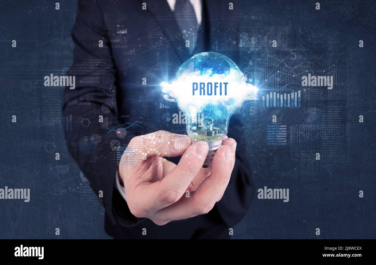 Businessman holding a light bulb, business concept Stock Photo - Alamy