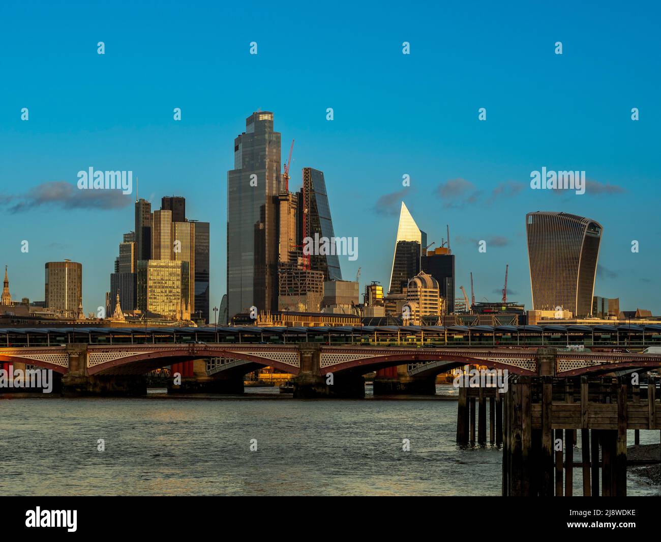 Blackfriars bridge crossing the river Thames with modern tower blocks ...