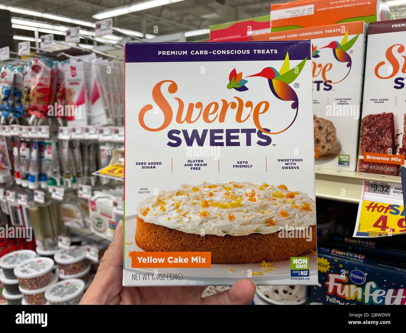 Augusta, Ga USA - 04 15 22: Hand holding Swerve Sweets yellow cake mix ...