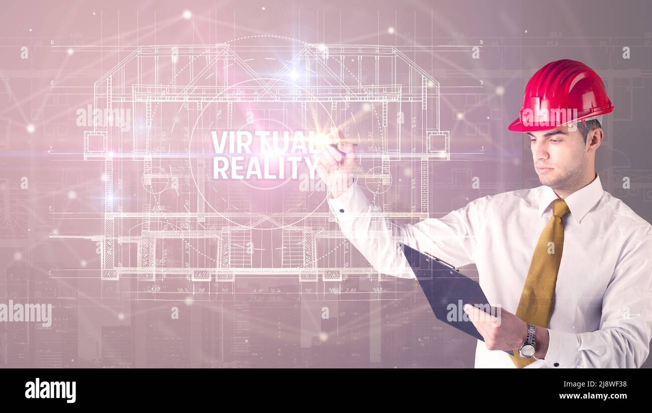 Handsome architect drawing with helmet Stock Photo - Alamy