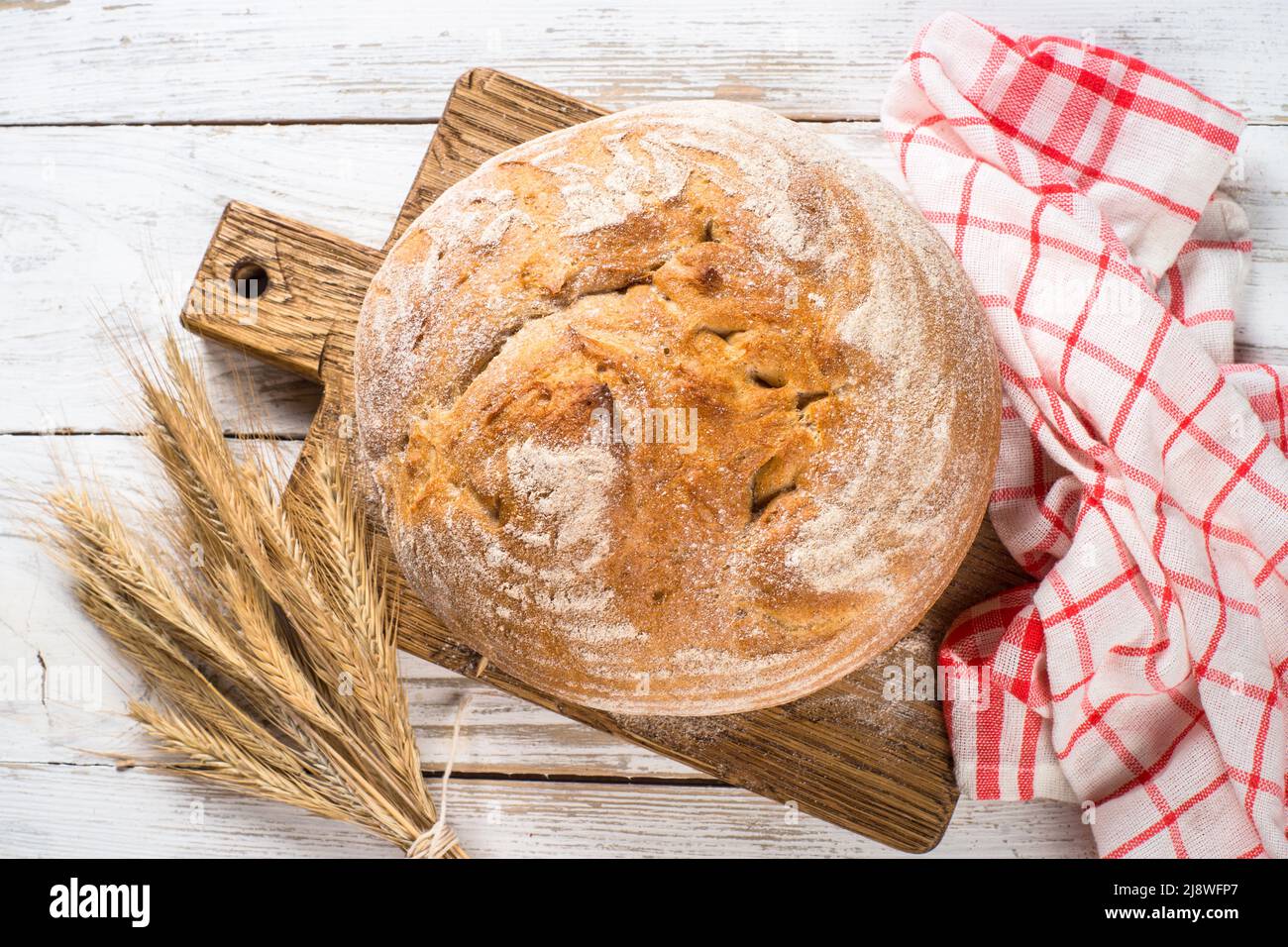 Homemade bread at white wooden table Stock Photo - Alamy