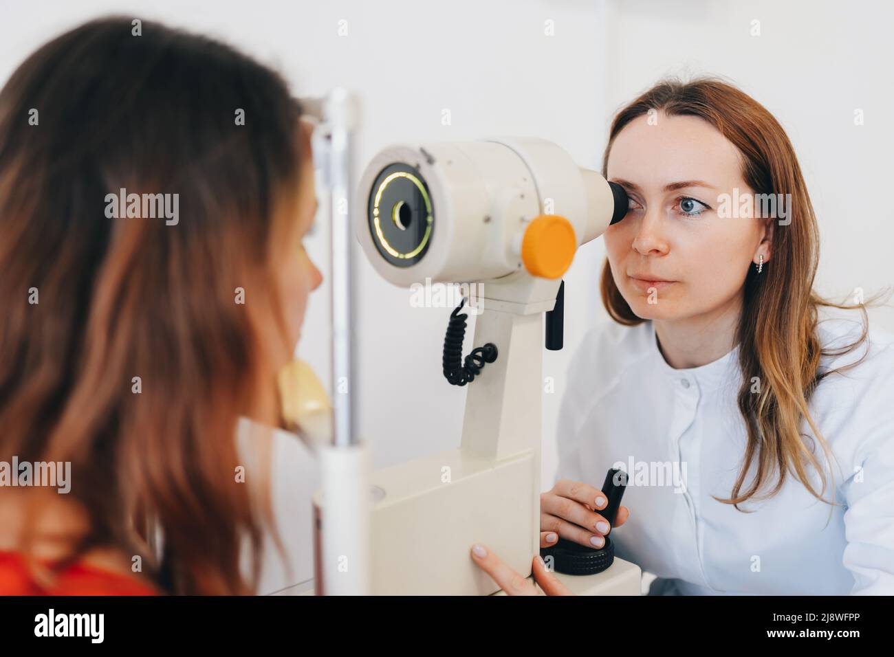 Eye test for visual acuity. The patient receives eye consultation Stock ...