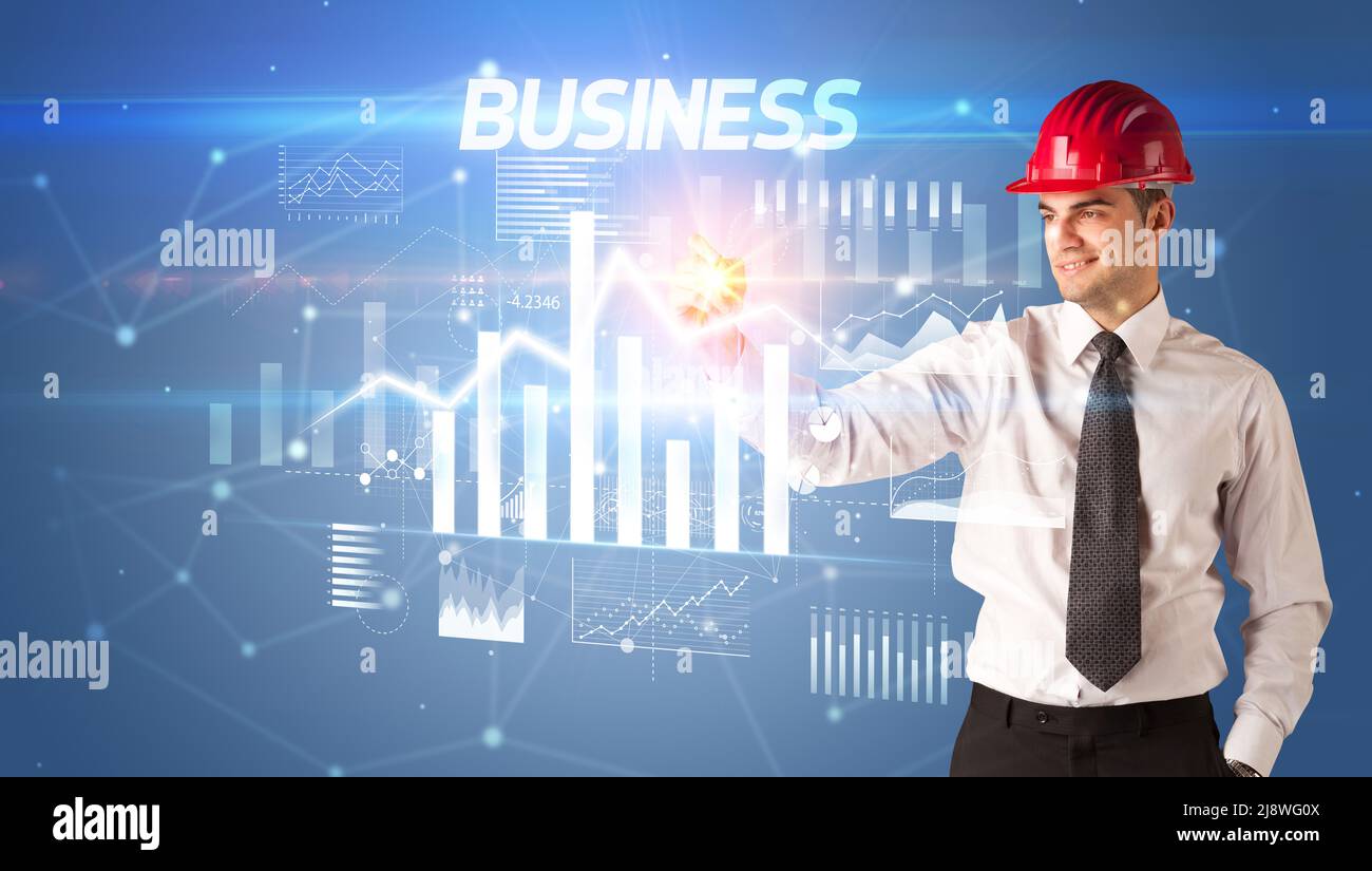 Young businessman with helmet drawing on virutal screen Stock Photo - Alamy