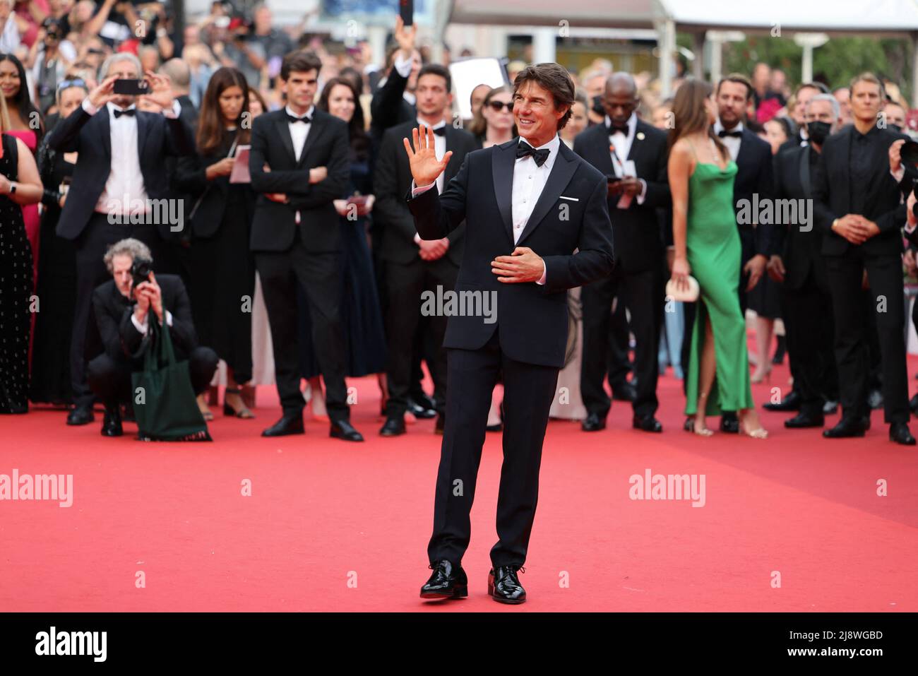 Tom Cruise posing during the screening of "Top Gun: Maverick" during ...