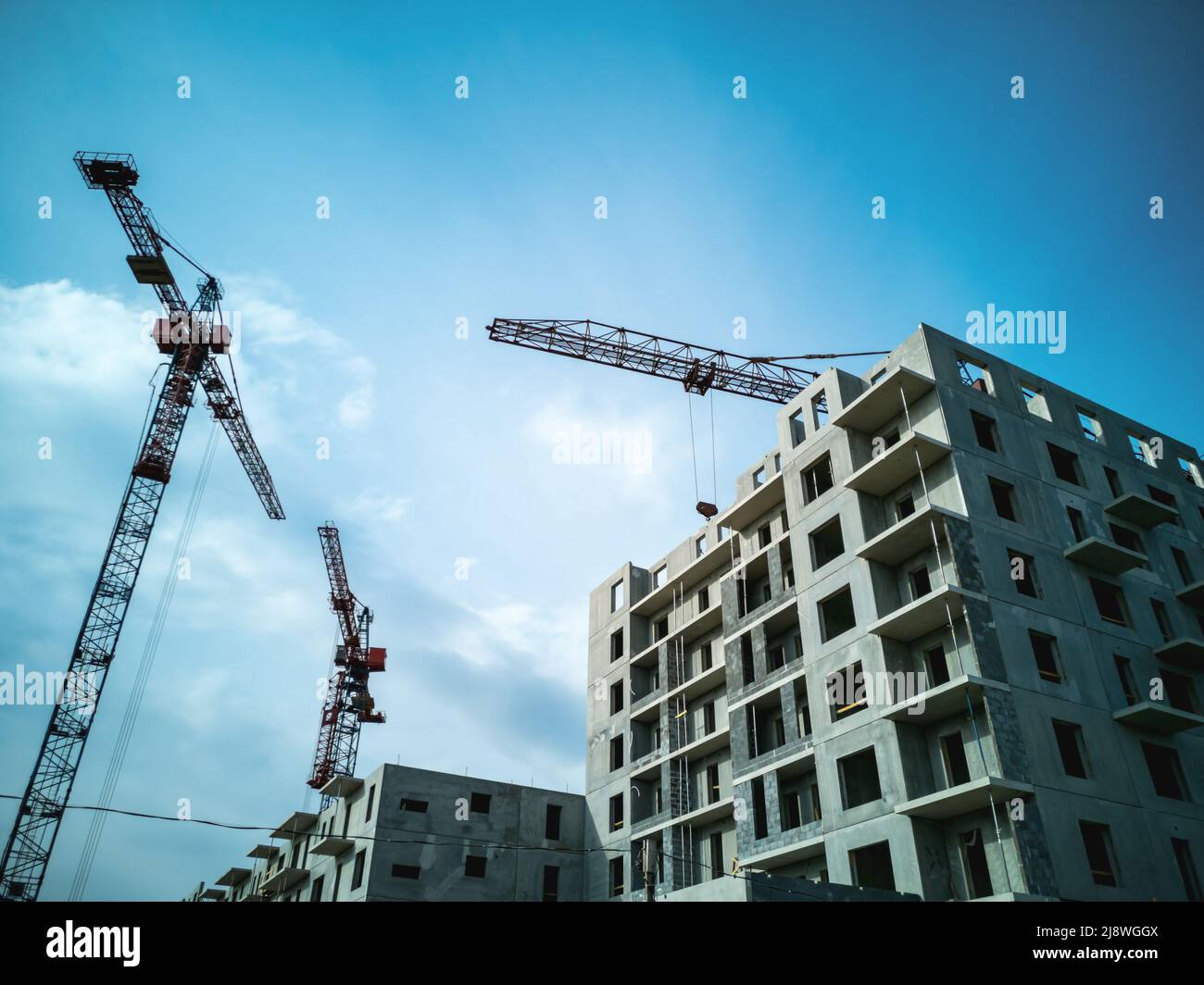 Construction of panel high-rise buildings.Tower cranes at the ...