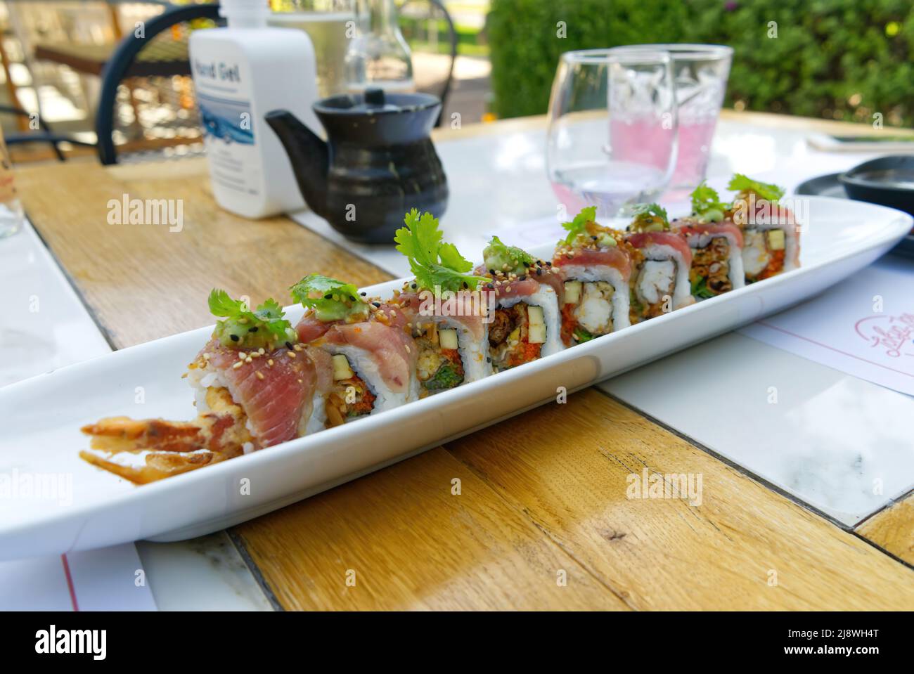 sushi restaurant. Outside table set up and dish presentation. Raw ...