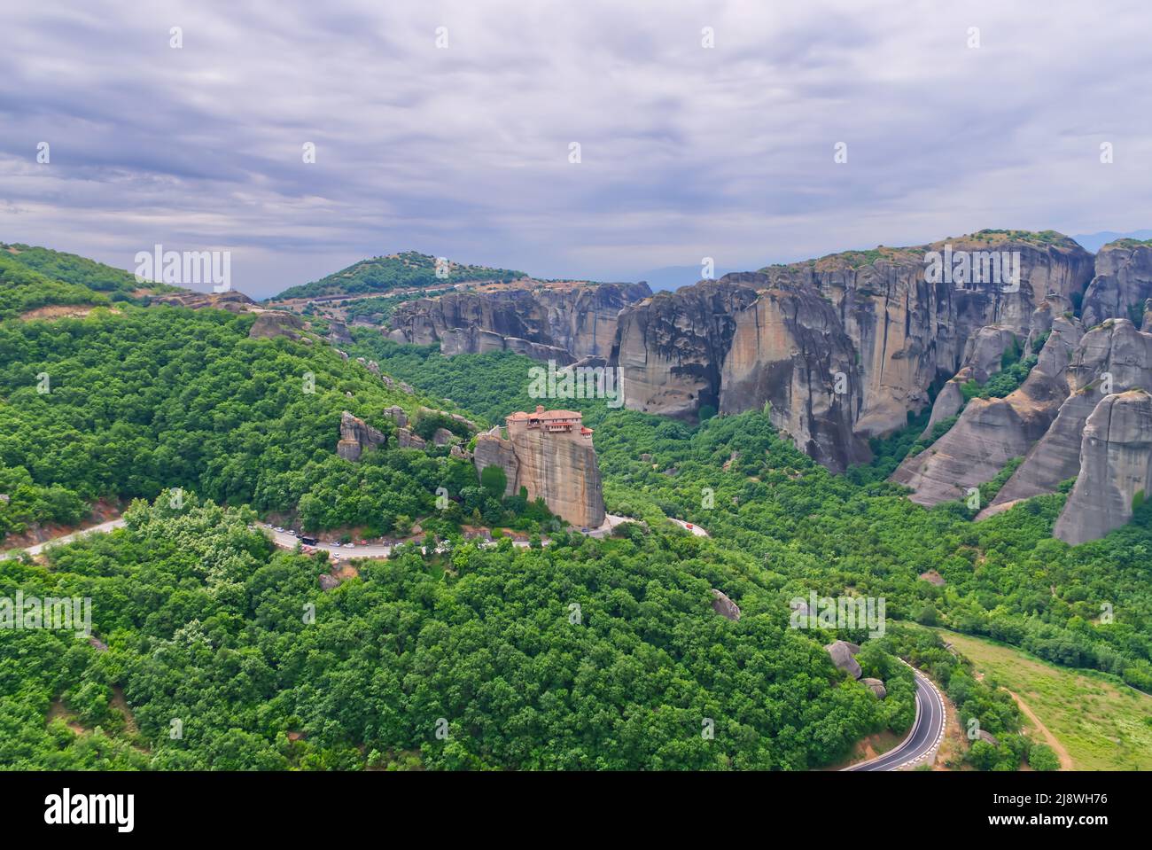 Stone monastery in the mountains. Kalabaka, Greece summer cloudy day in ...