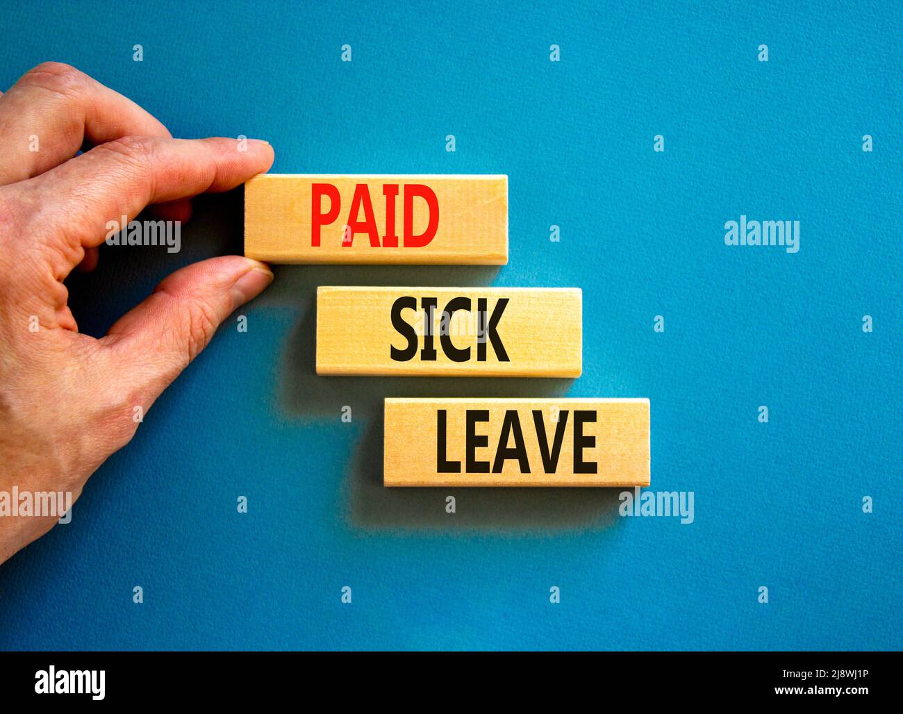 Paid sick leave symbol. Concept words Paid sick leave on wooden blocks ...