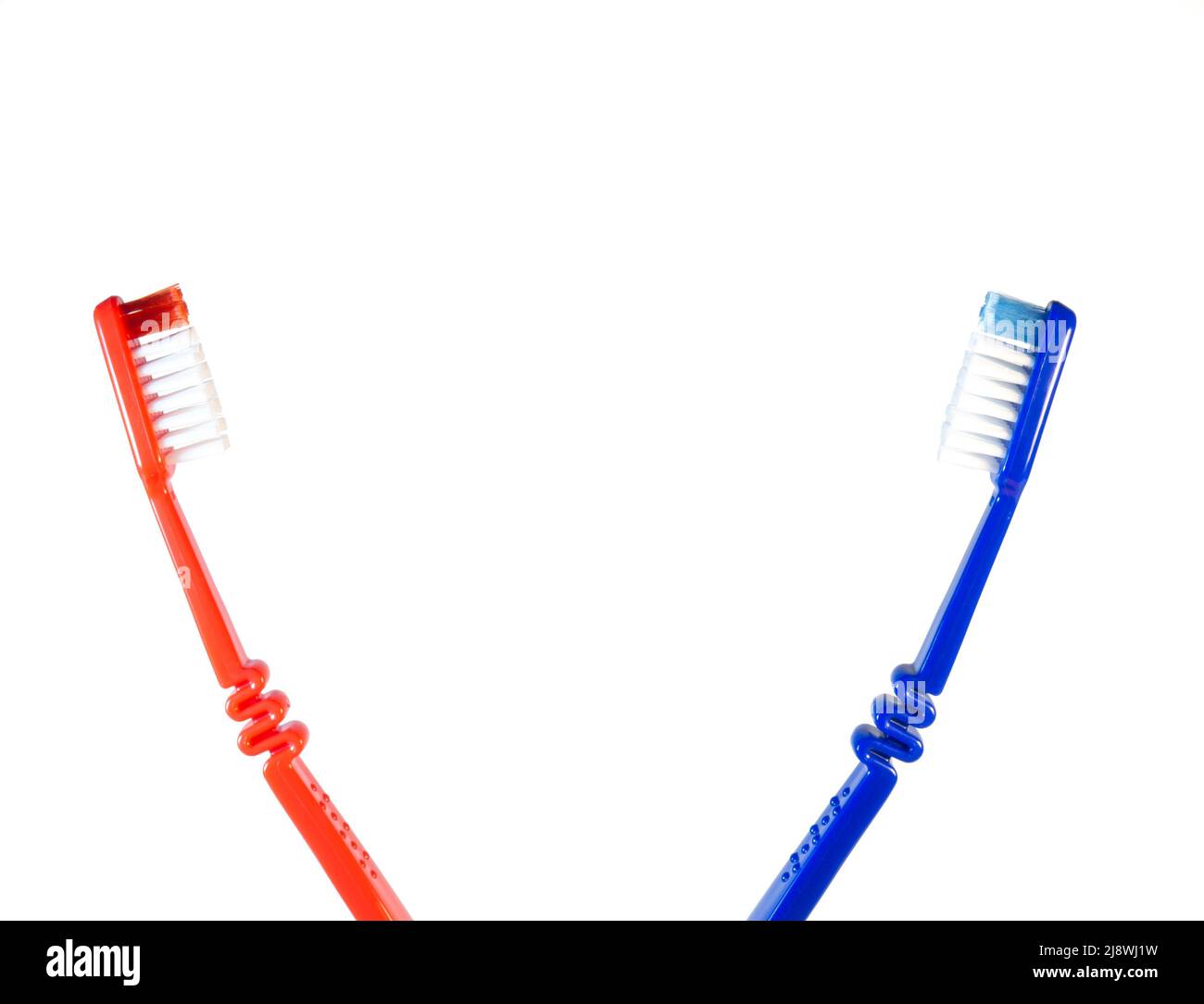 Two toothbrushes on a white background. Blue and red toothbrushes Stock ...