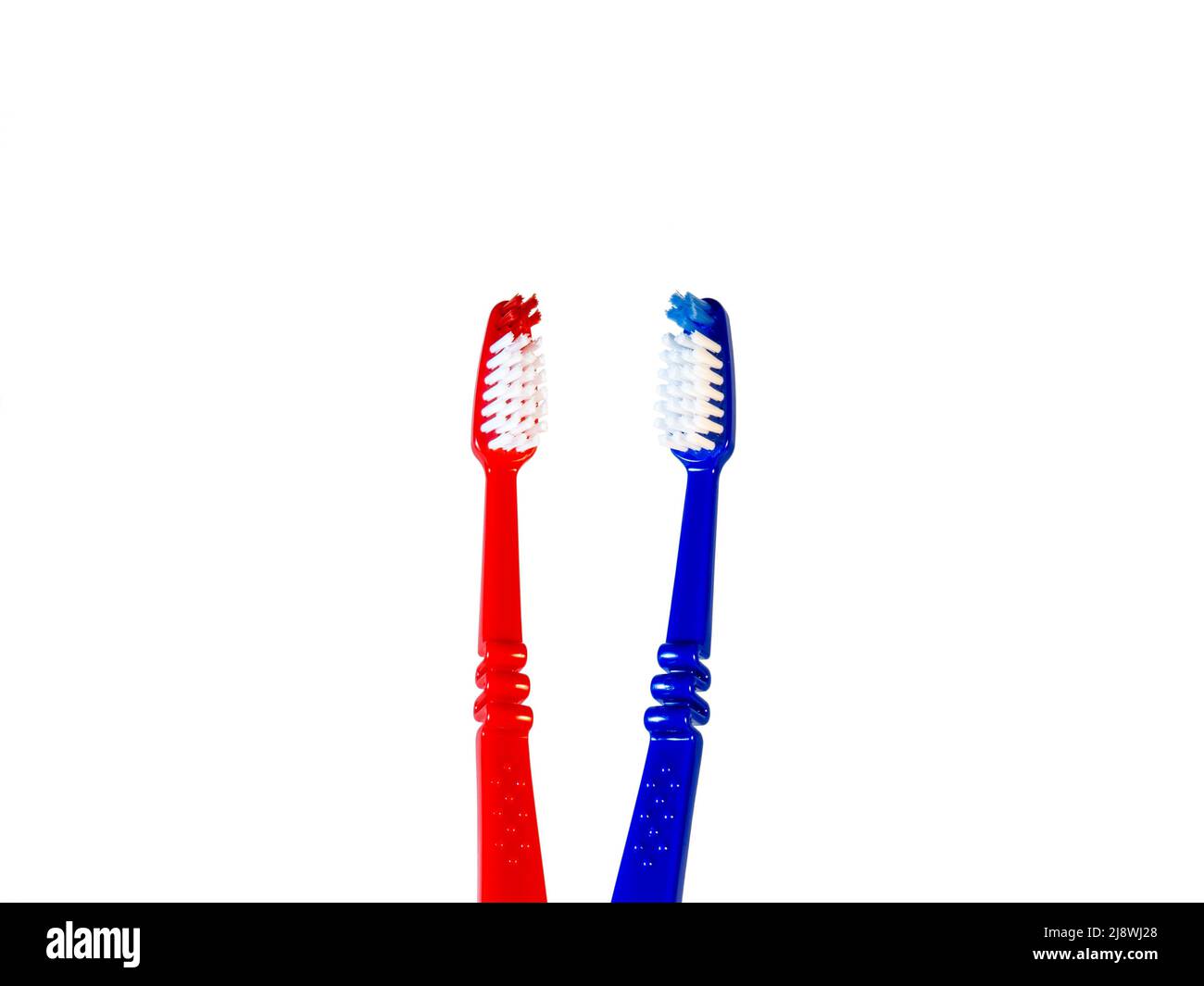 Two toothbrushes on a white background. Blue and red toothbrushes Stock ...