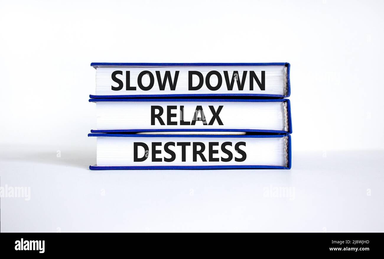 Destress symbol. Concept words Slow down Relax Destress on books ...