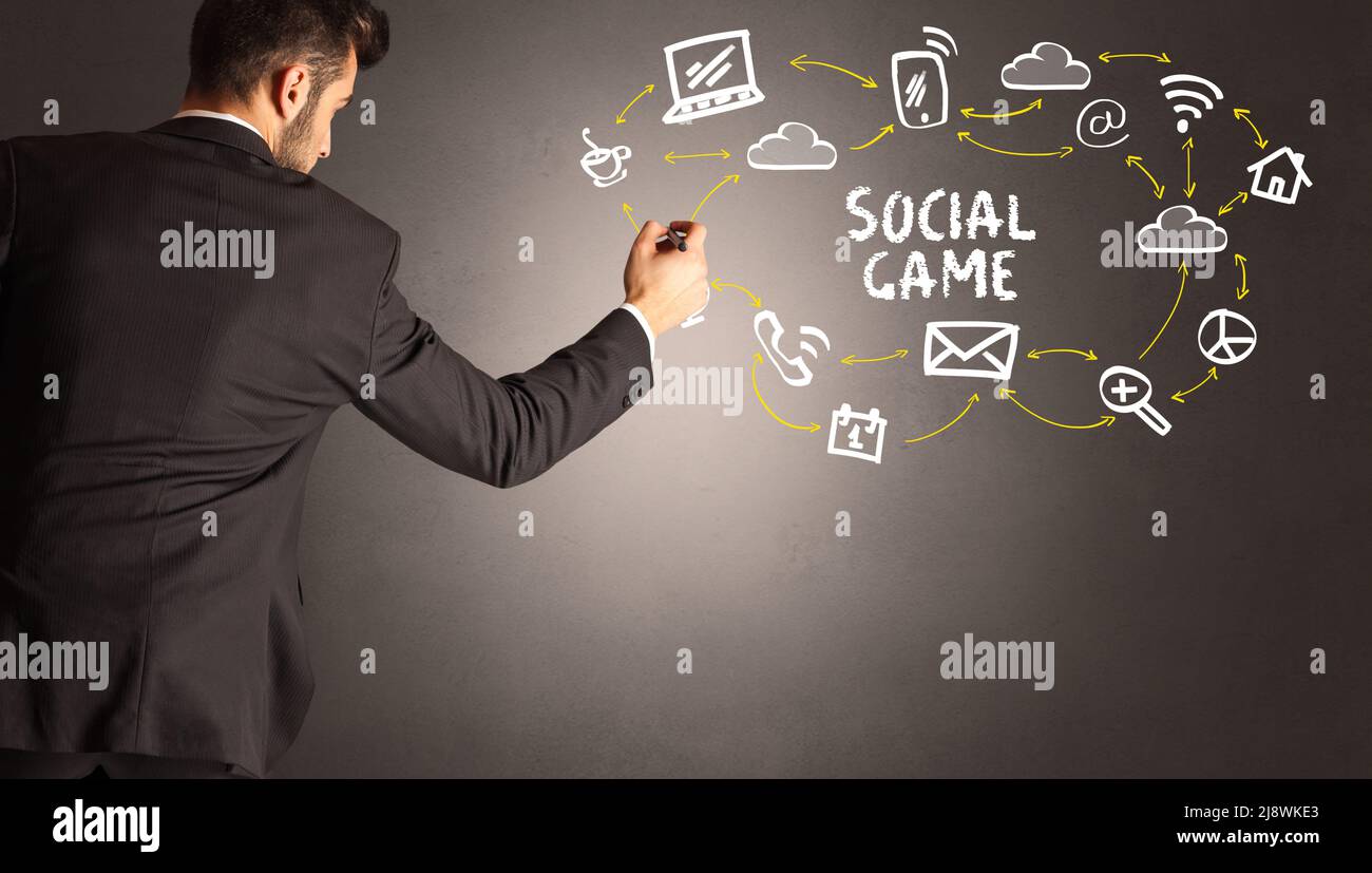 businessman drawing social media icons Stock Photo - Alamy