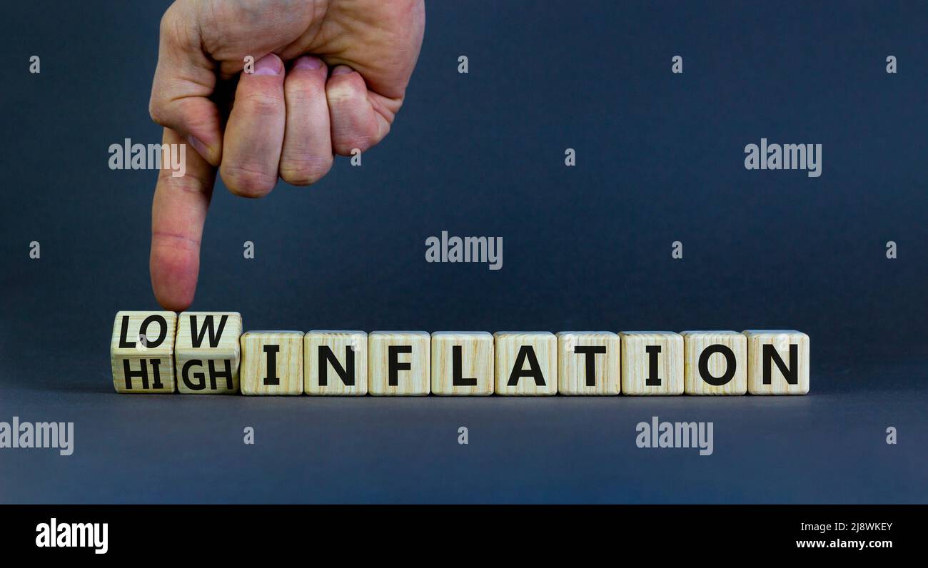 High or low inflation symbol. Businessman turns cubes and changes ...