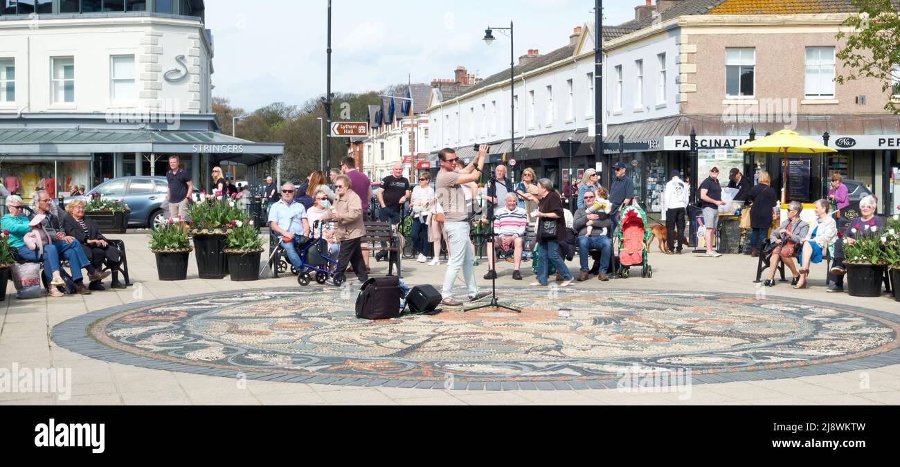 Street entertainer sings in Lytham Town square Stock Photo - Alamy