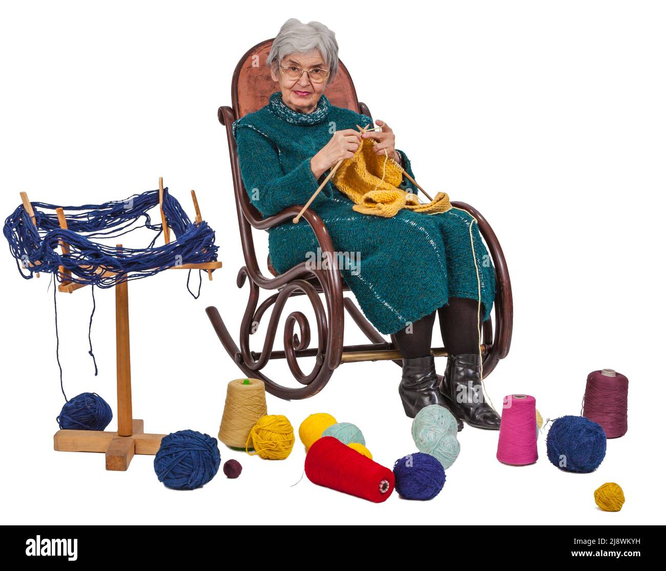 Image of an old woman sitting on a rocker and knitting, isolated ...