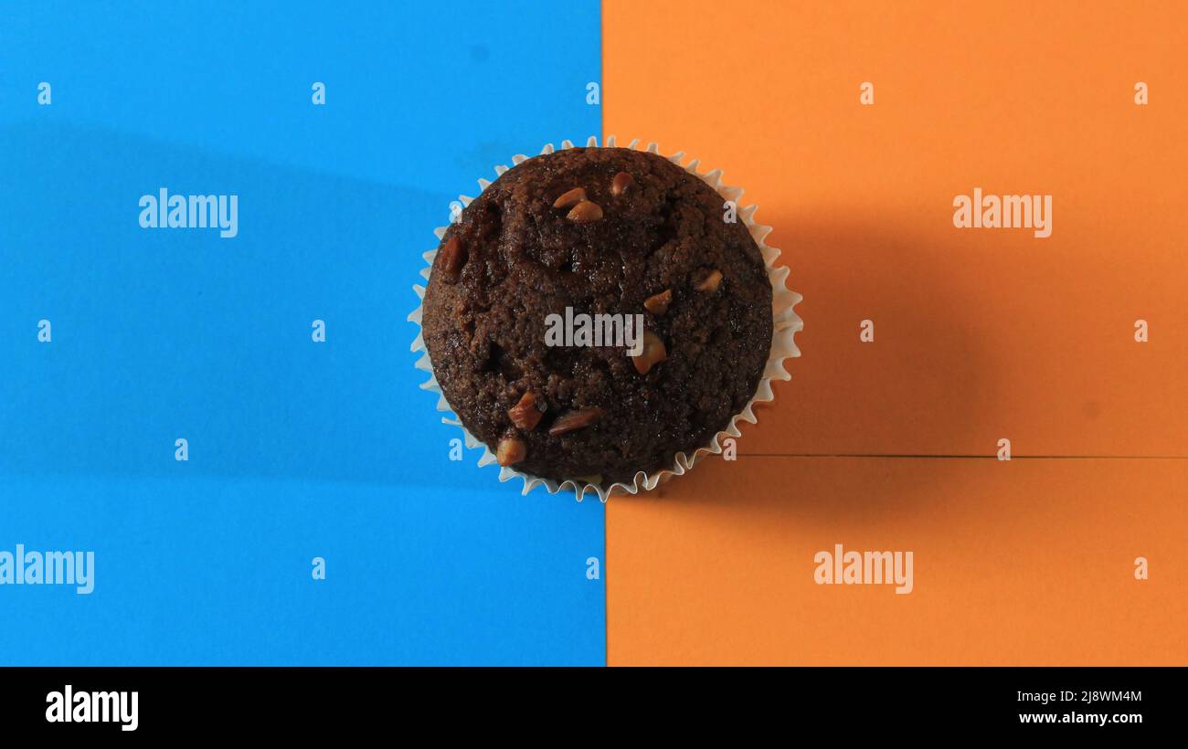 Chocolate muffin isolated on color background. Delicious chocolate ...