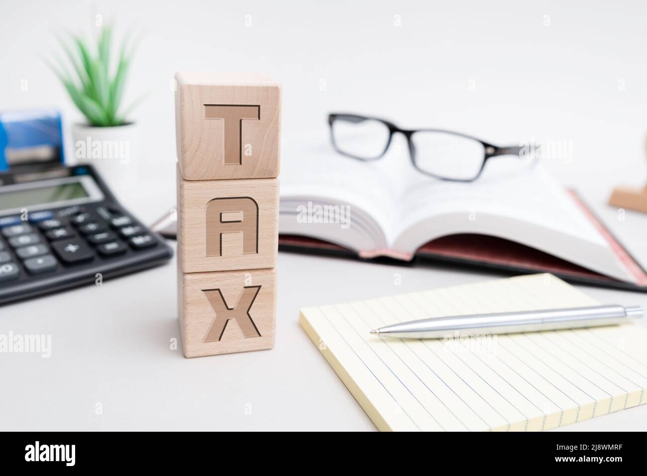 Budget, finance and tax concept with wooden blocks Stock Photo - Alamy