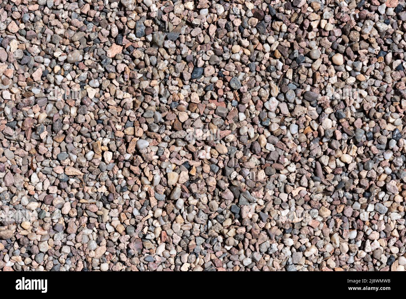 Loose stone gravel. Stones background texture top view Stock Photo - Alamy