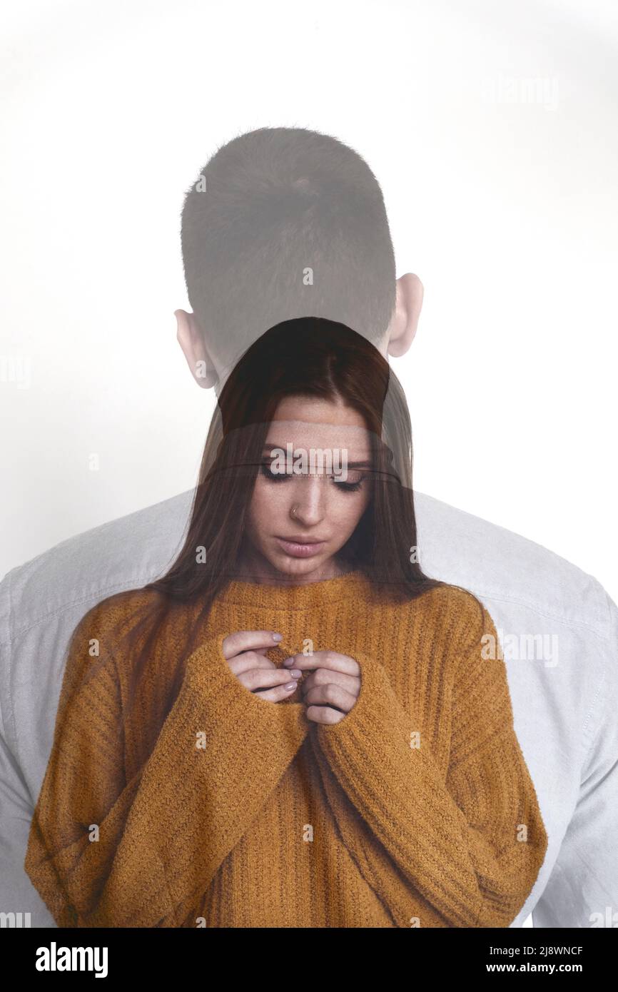 Portrait of young beautiful woman standing with her back to ...