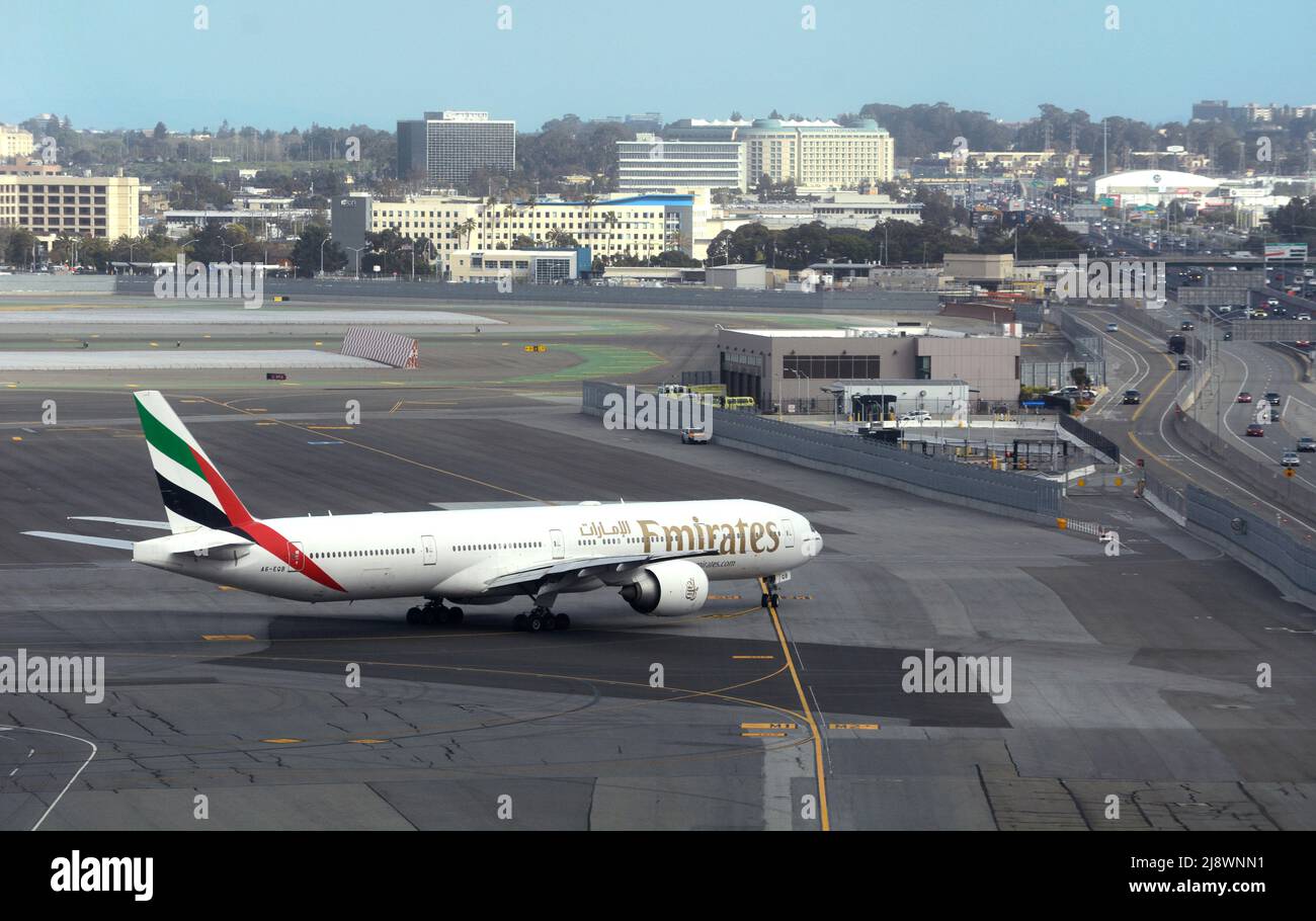 An Emirates Boeing 777 passenger plane taxis toward the runway for take ...