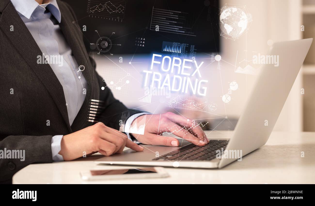 Side view of a business person working on laptop Stock Photo - Alamy