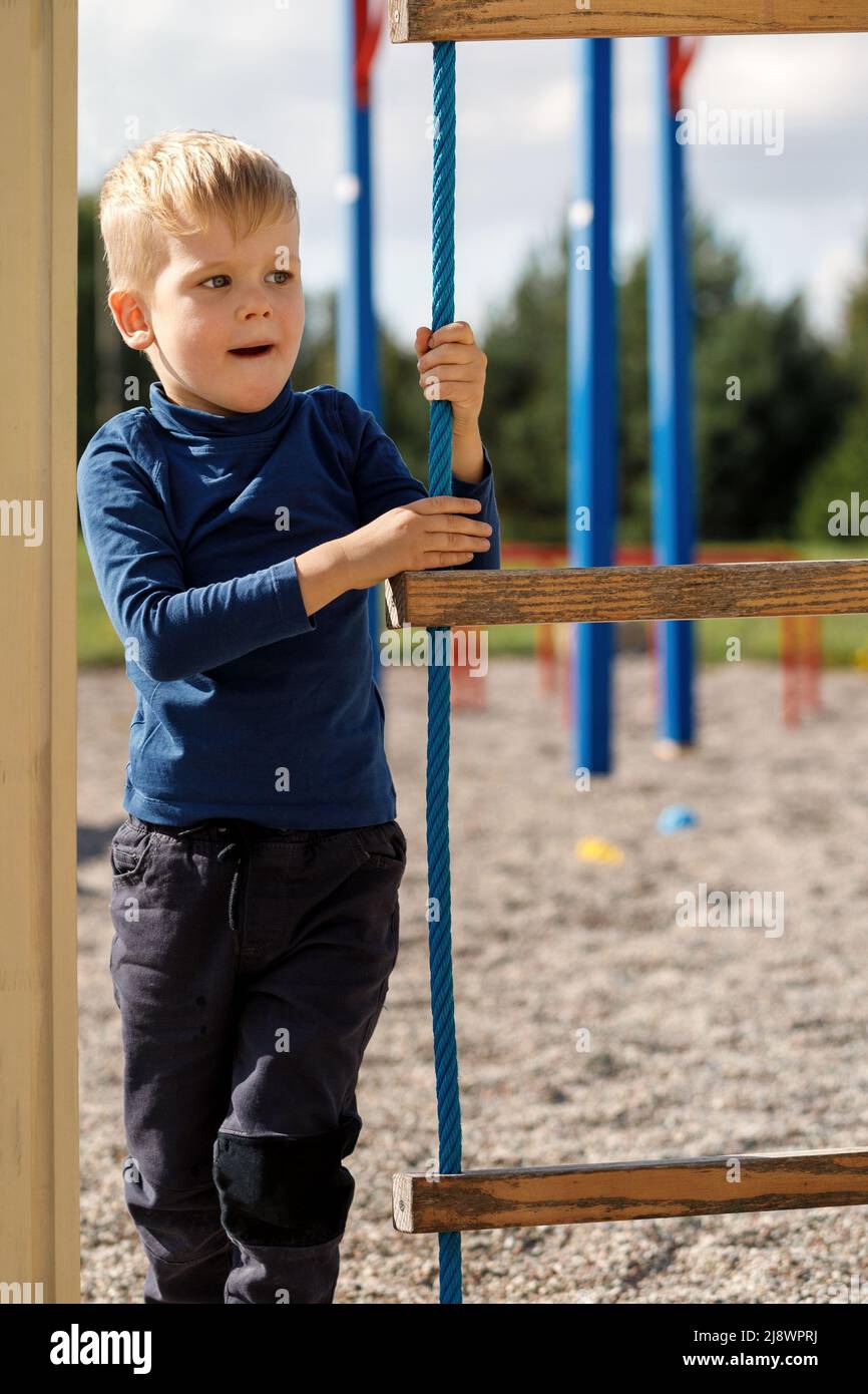Child on a rope ladder hi-res stock photography and images - Alamy