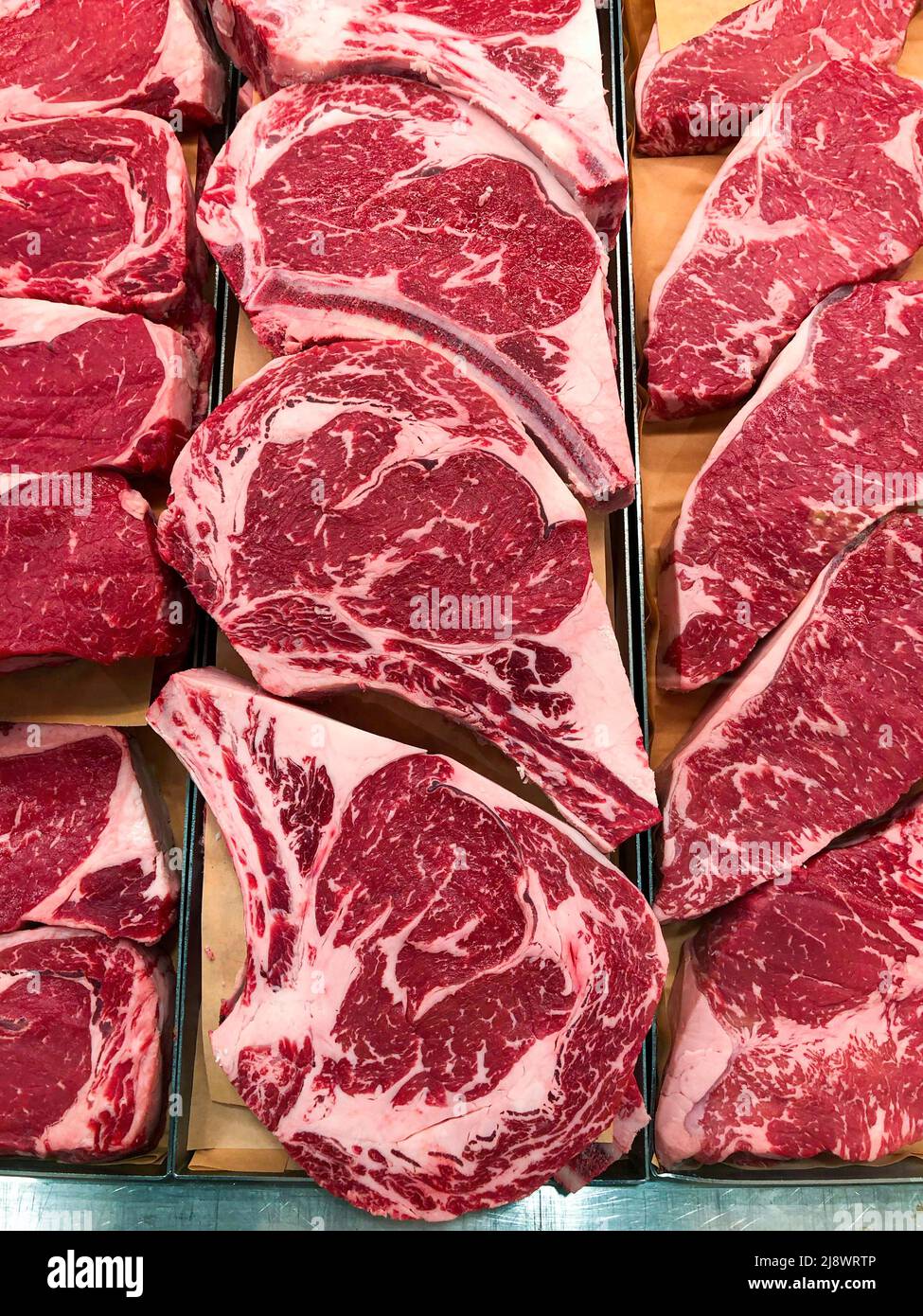 Bone in beef ribeye steak, raw Stock Photo - Alamy
