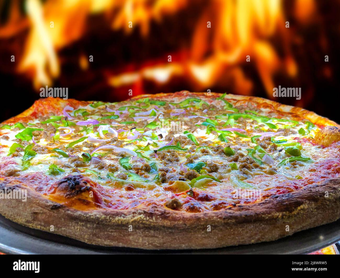 Pizza baked in a wood fired oven Stock Photo - Alamy