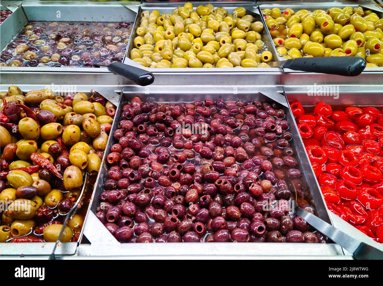 Assorted olives in the bulk market Stock Photo - Alamy