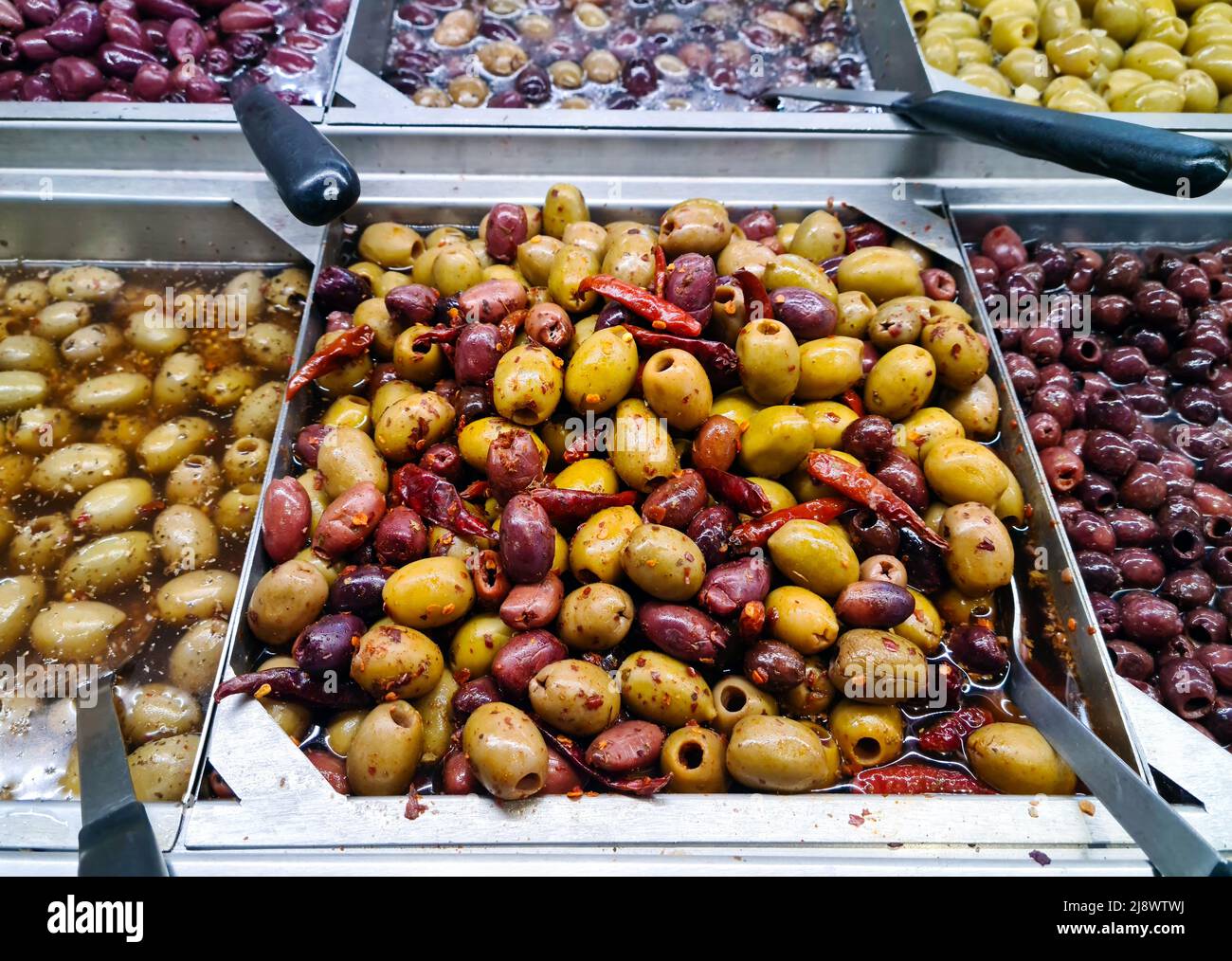 Assorted olives in the bulk market Stock Photo - Alamy