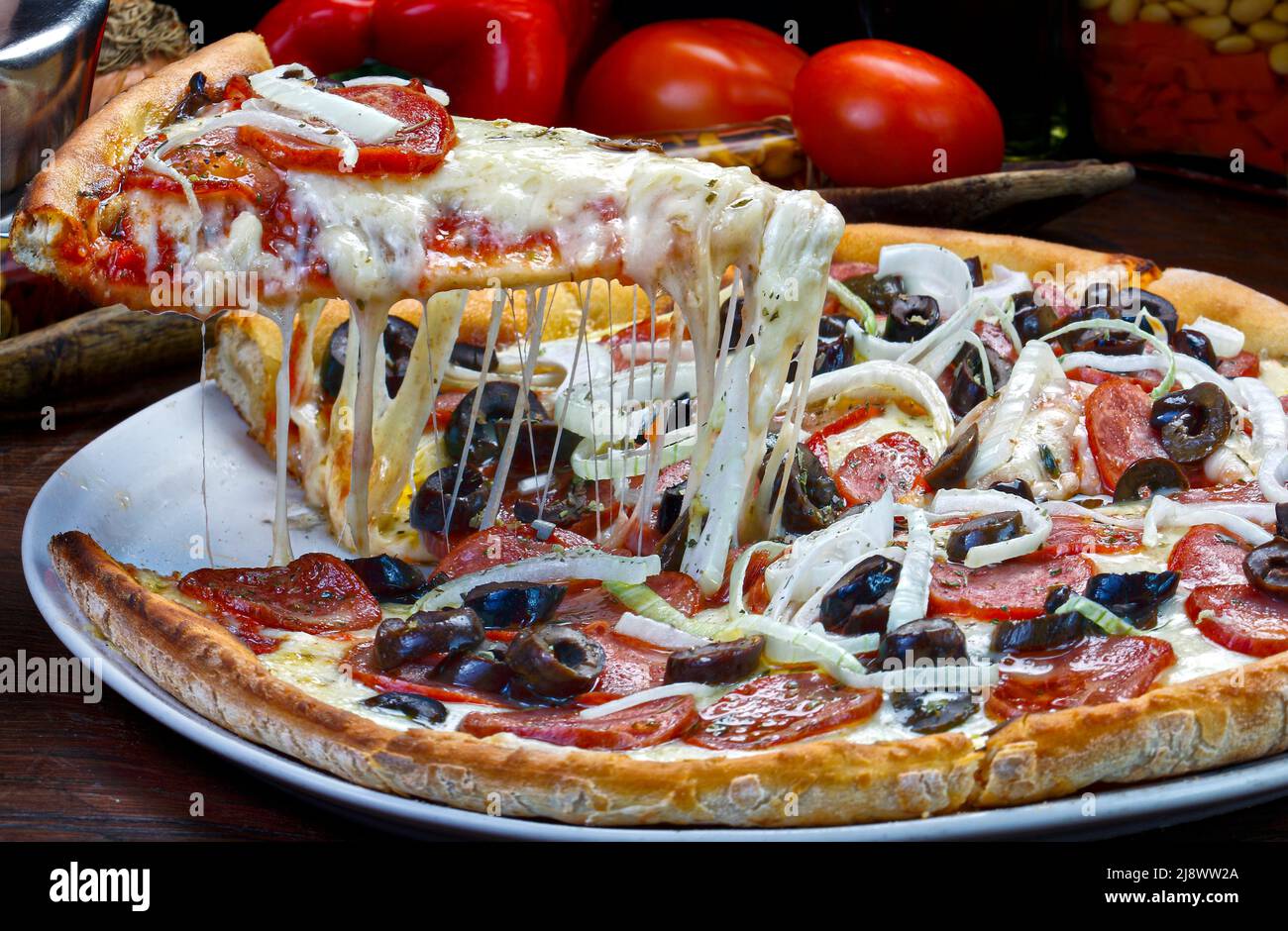 Pepperoni pizza slice melted mozzarella cheese Stock Photo - Alamy
