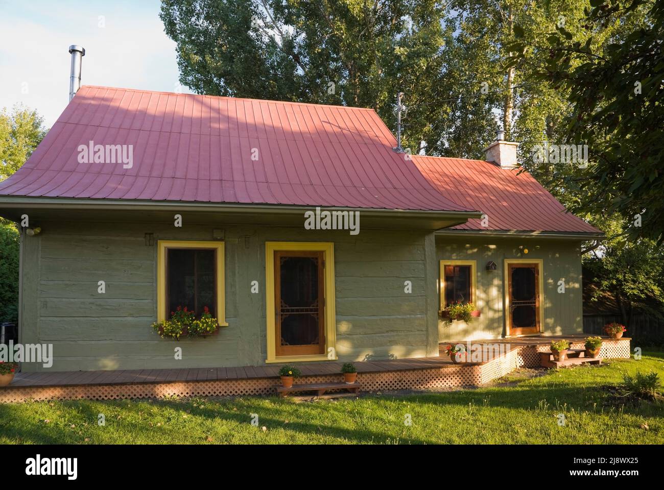 Old circa 1840 Canadiana cottage style olive green painted log home ...