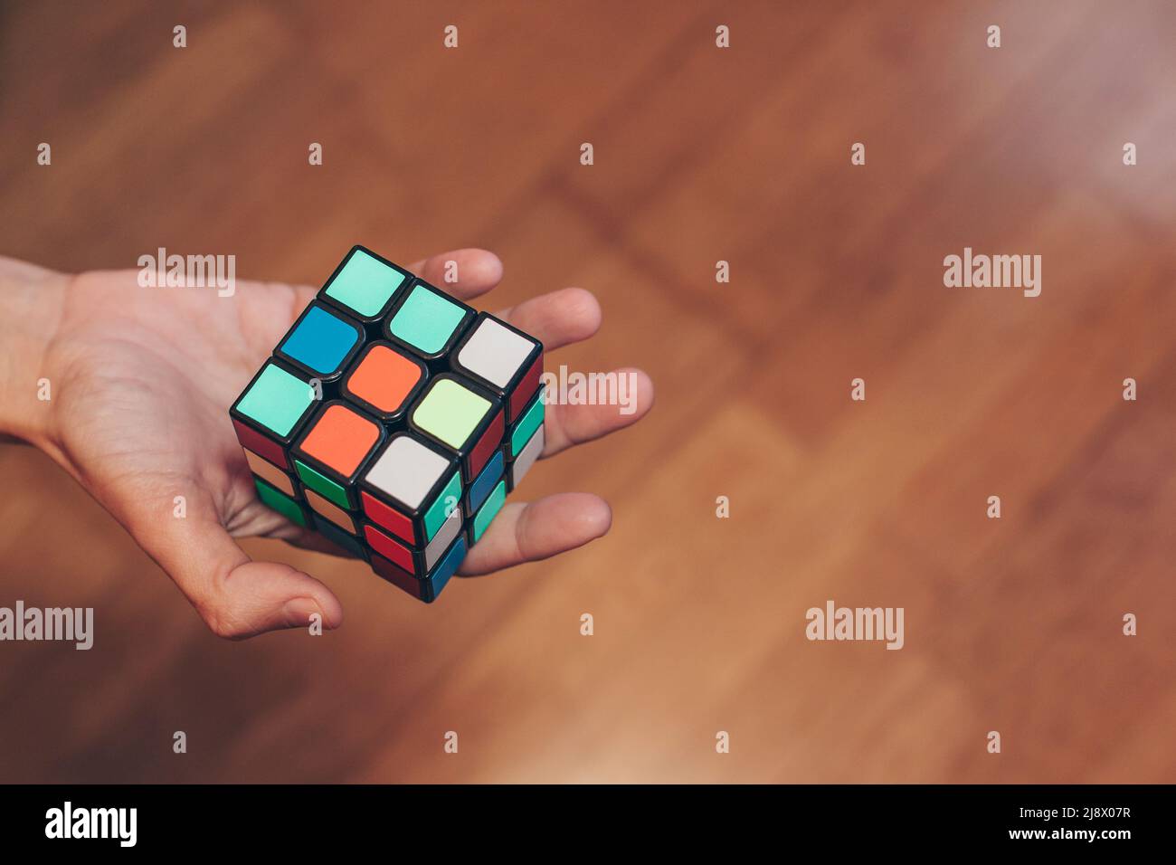 Hand holding a bucket on a wooden background. Concept strategies ...