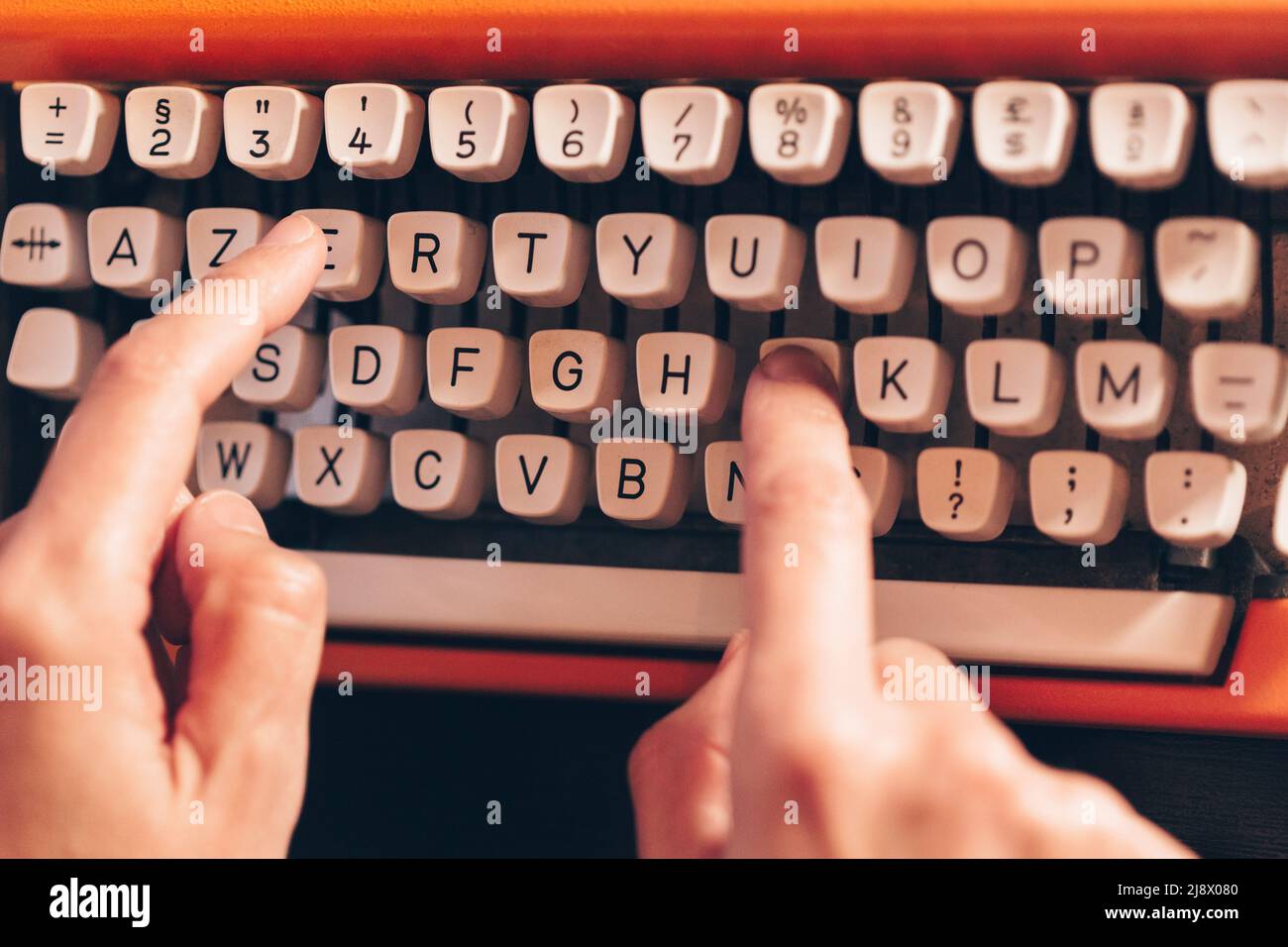 Close-up of fingers on retro typewriter Stock Photo - Alamy