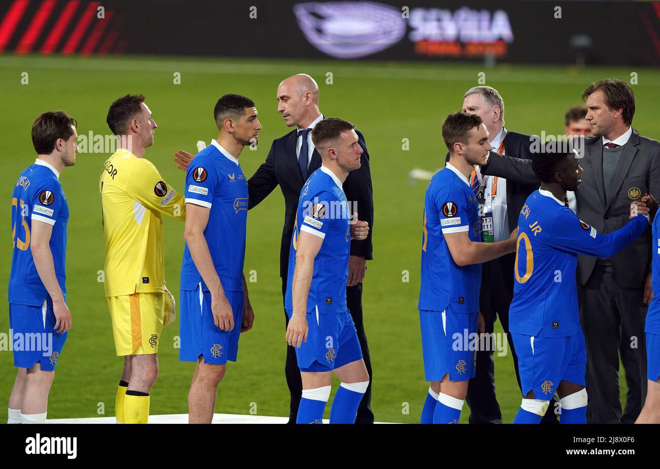 Rangers players (Aaron Ramsey, centre) receive their runners up medals ...