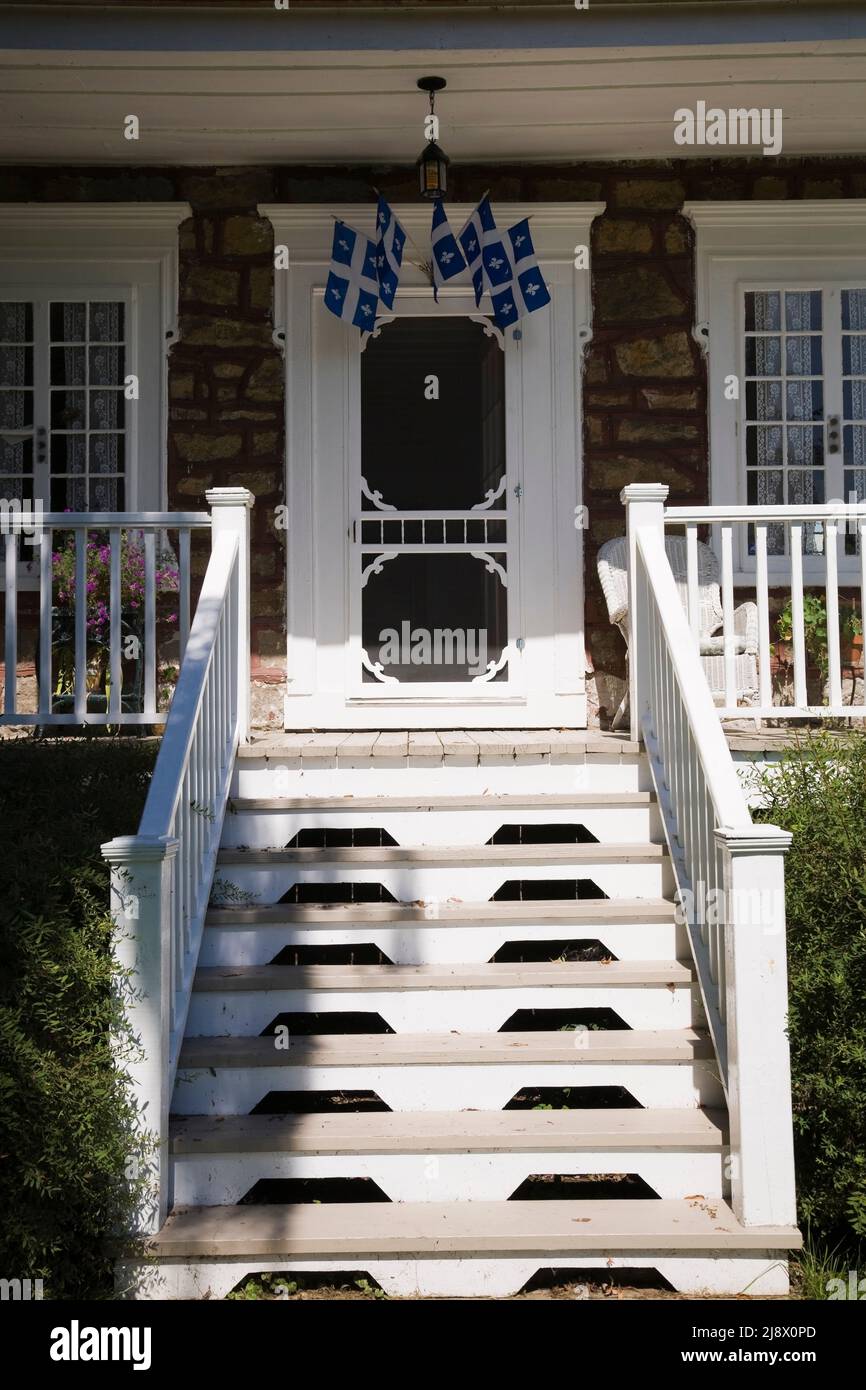 Stairs leading to veranda on old Canadiana 1831 cottage style quarry ...