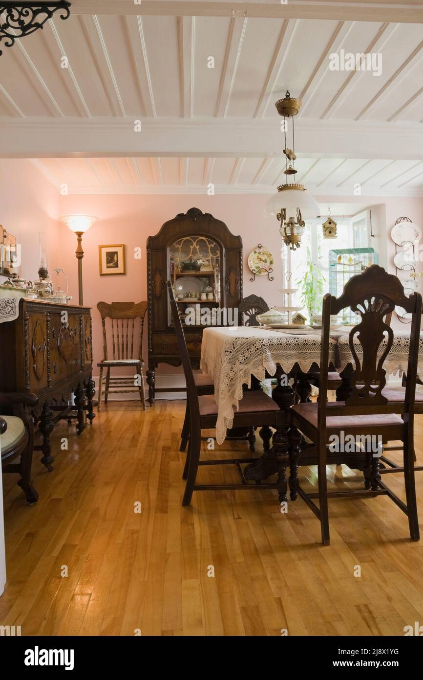 Antique table, high back chairs and furnishings in dining room inside ...