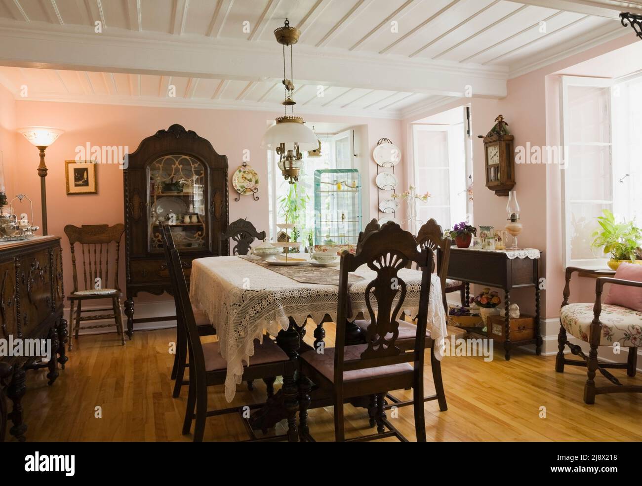 Antique table, high back chairs and furnishings in dining room inside ...
