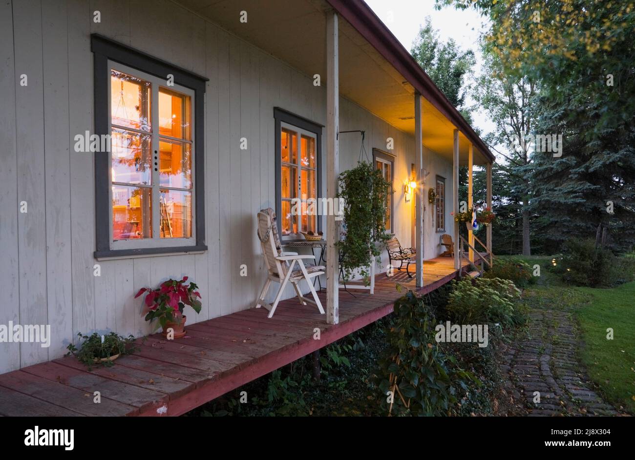 Old circa 1859 Canadiana cottage style home facade with wood plank ...